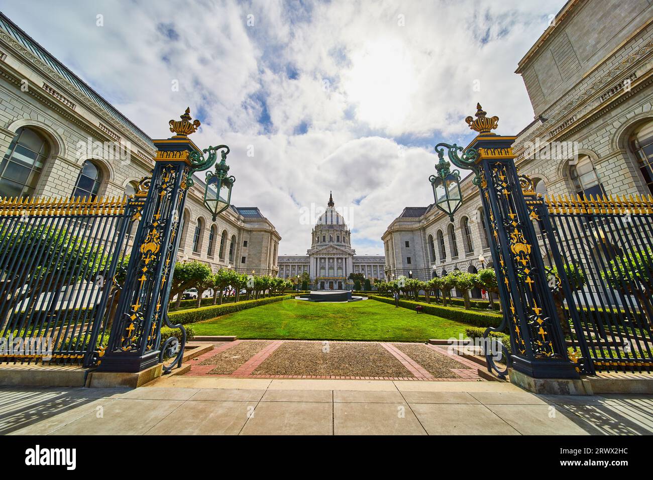 Dark blue and golden gilded gated entrance with fancy lanterns leading ...