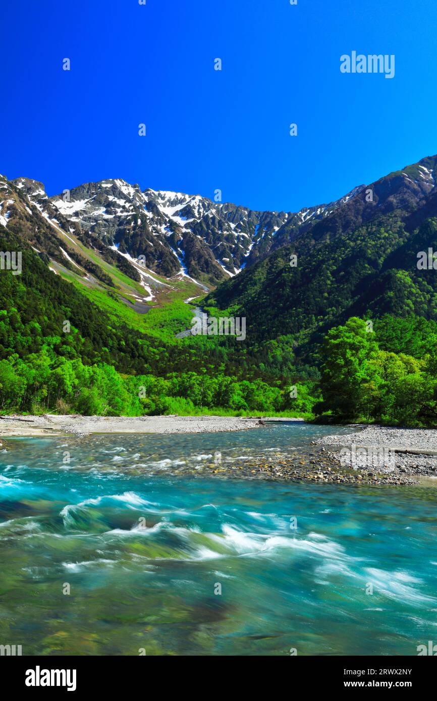 Clear clear Azusa River and snow-capped Hotaka mountain peaks in ...