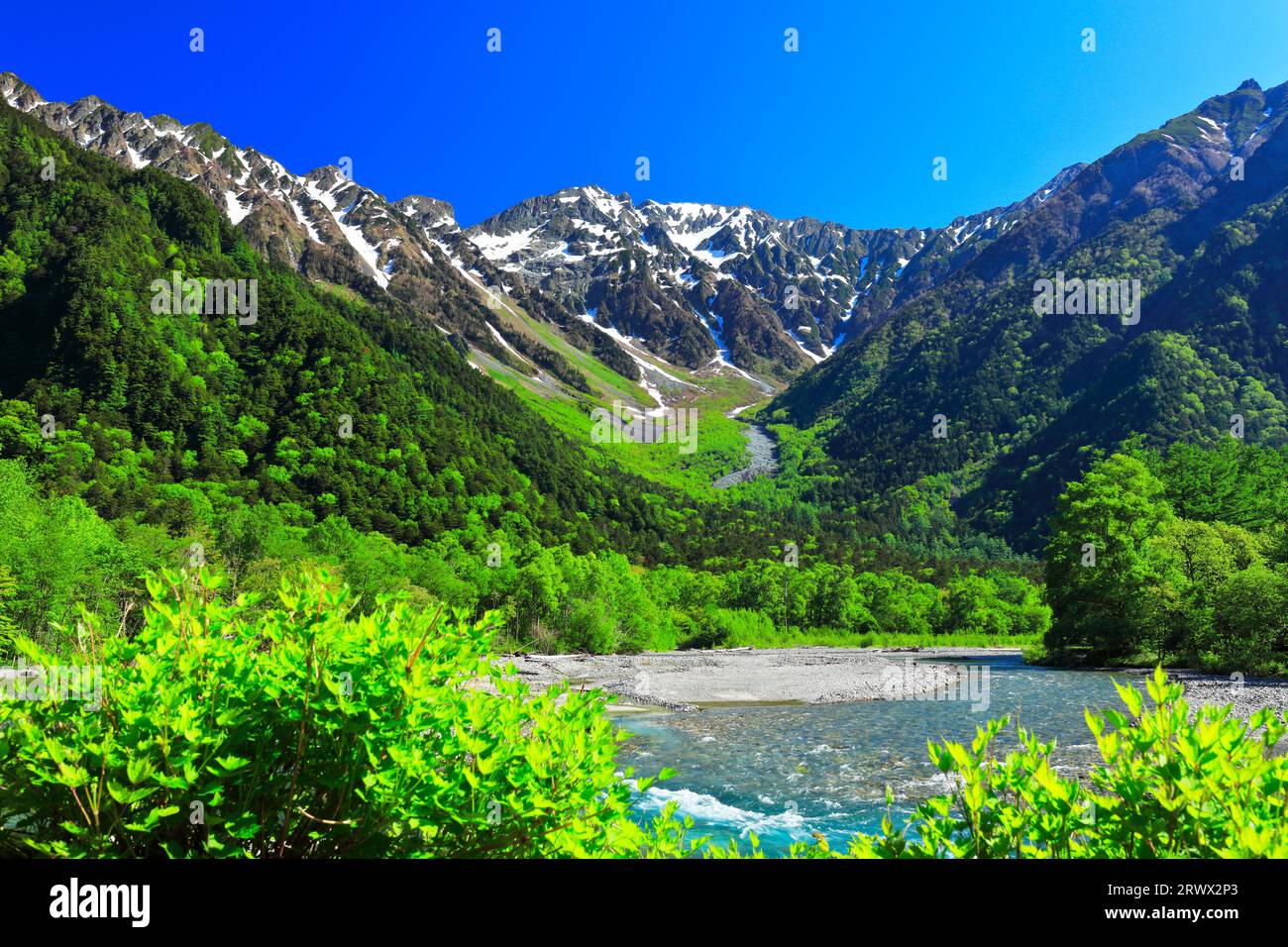 Clear clear Azusa River and snow-capped Hotaka mountain peaks in ...