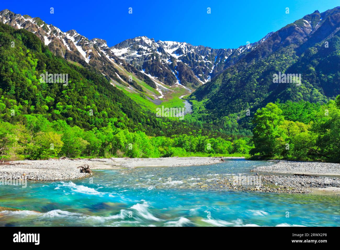 Clear clear Azusa River and snow-capped Hotaka mountain peaks in ...