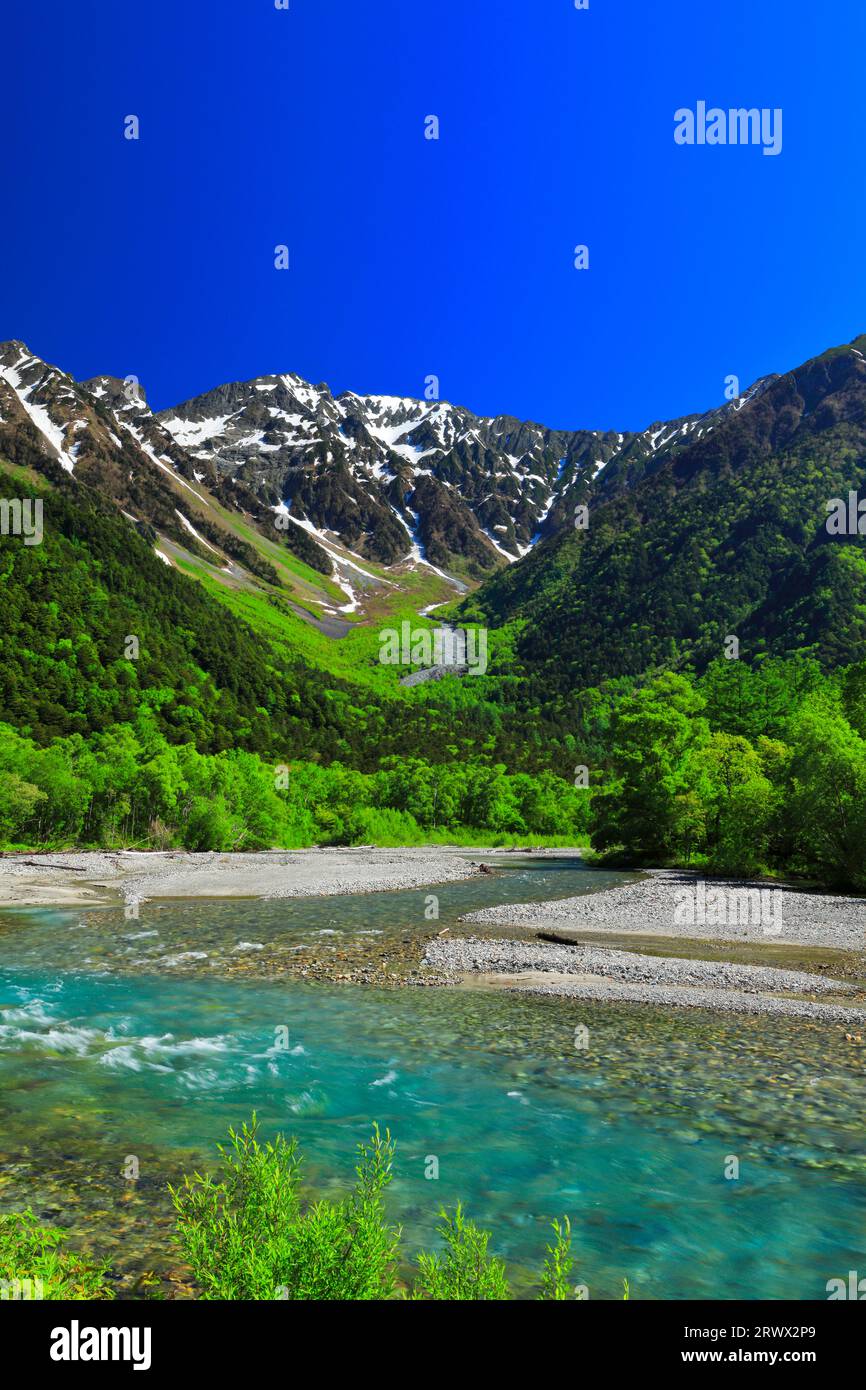 Clear clear Azusa River and snow-capped Hotaka mountain peaks in ...