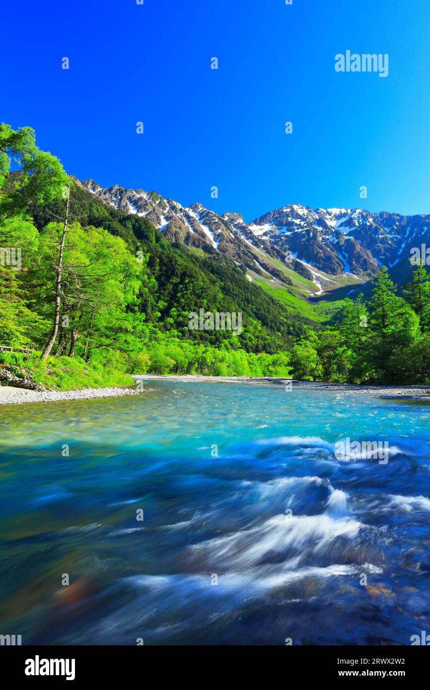Clear clear Azusa River and snow-capped Hotaka mountain peaks in ...