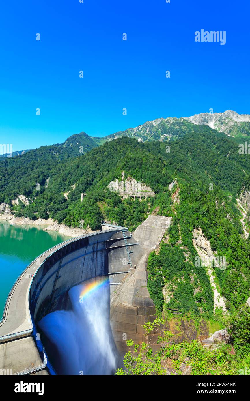 Rainbow and Kurobe Dam water discharge in summer in Tateyama Stock ...