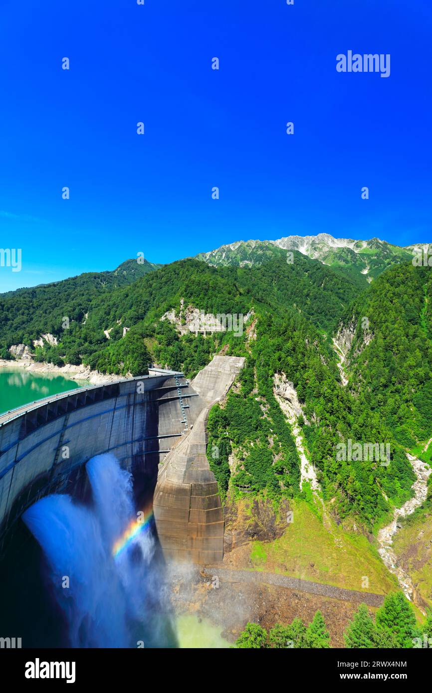 Rainbow and Kurobe Dam water discharge in summer in Tateyama Stock ...