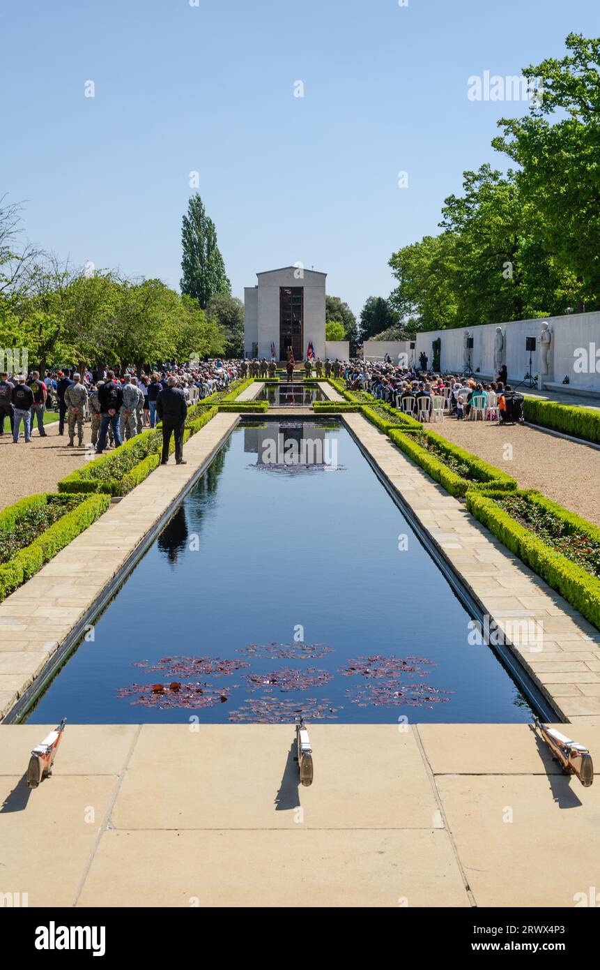 Reflecting pool leading to chapel, and memorial wall at the Cambridge ...