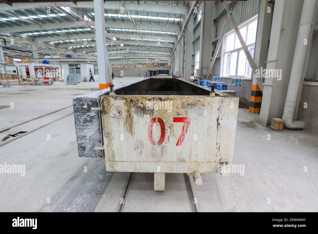 The raw material transport vehicle is on the track in a factory Stock ...