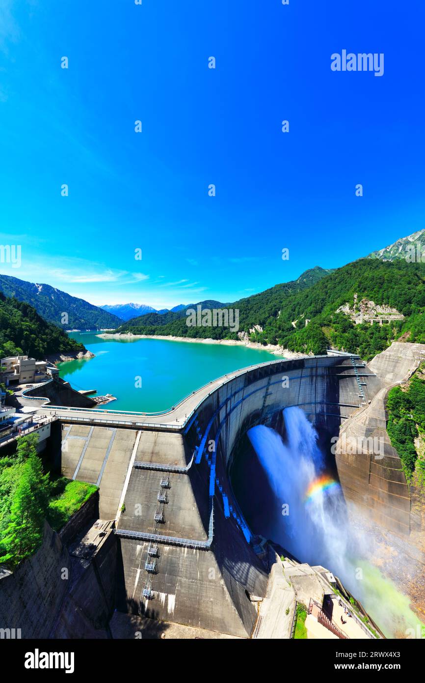Rainbow and Kurobe Dam water discharge in summer in Tateyama Stock ...