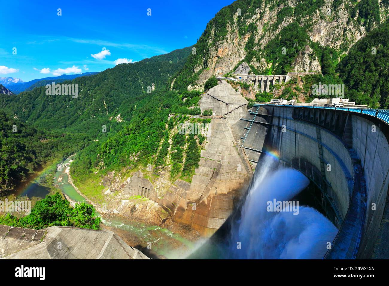 Rainbow and Kurobe Dam water discharge in summer in Tateyama Stock ...
