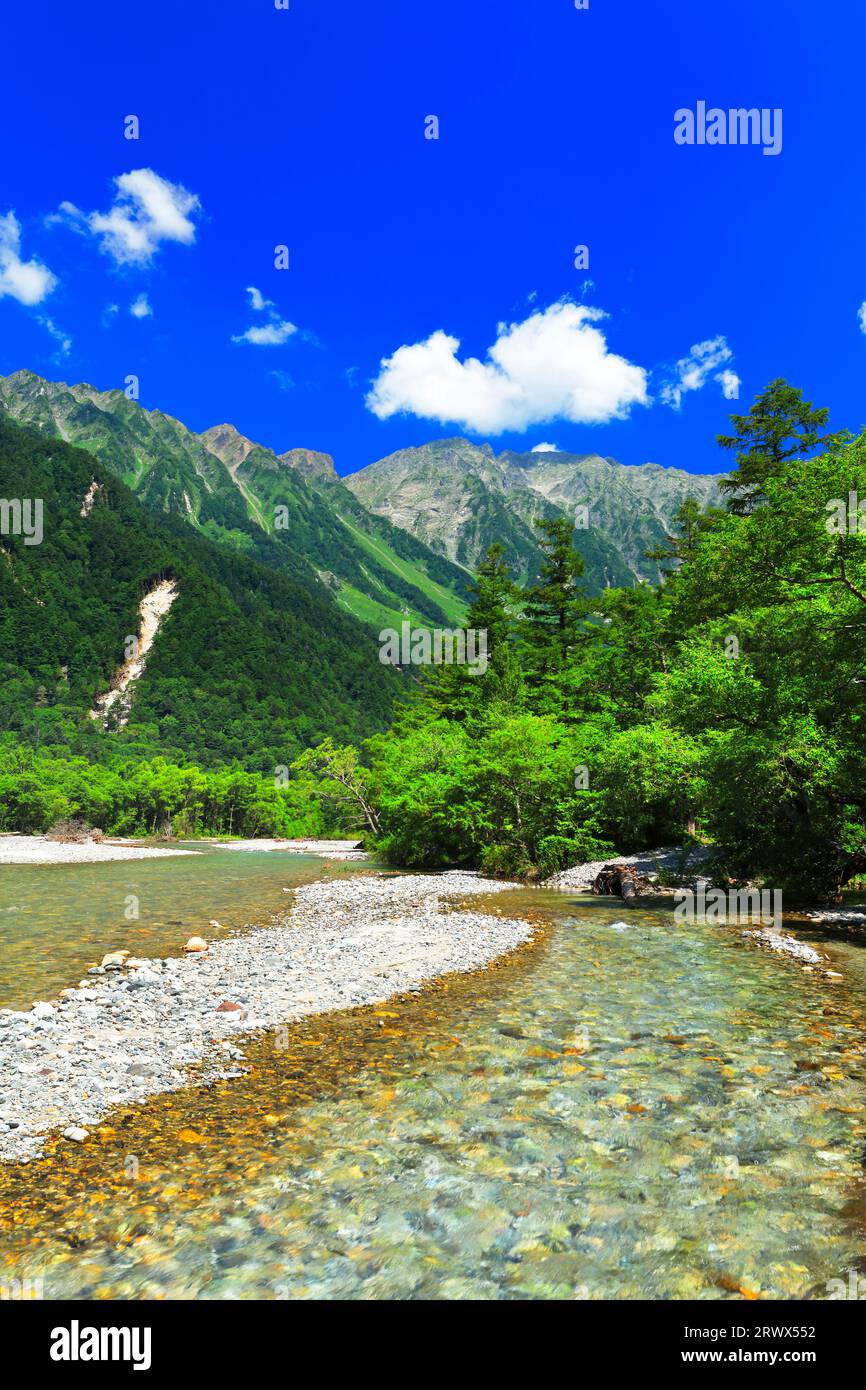 The clear stream of Azusa River and Hotaka mountain range in summer in ...