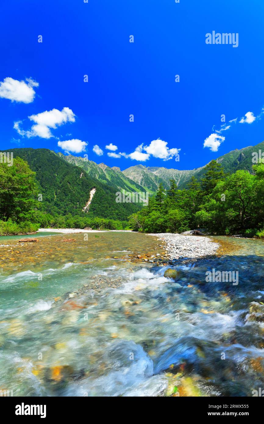 The clear stream of Azusa River and Hotaka mountain range in summer in ...