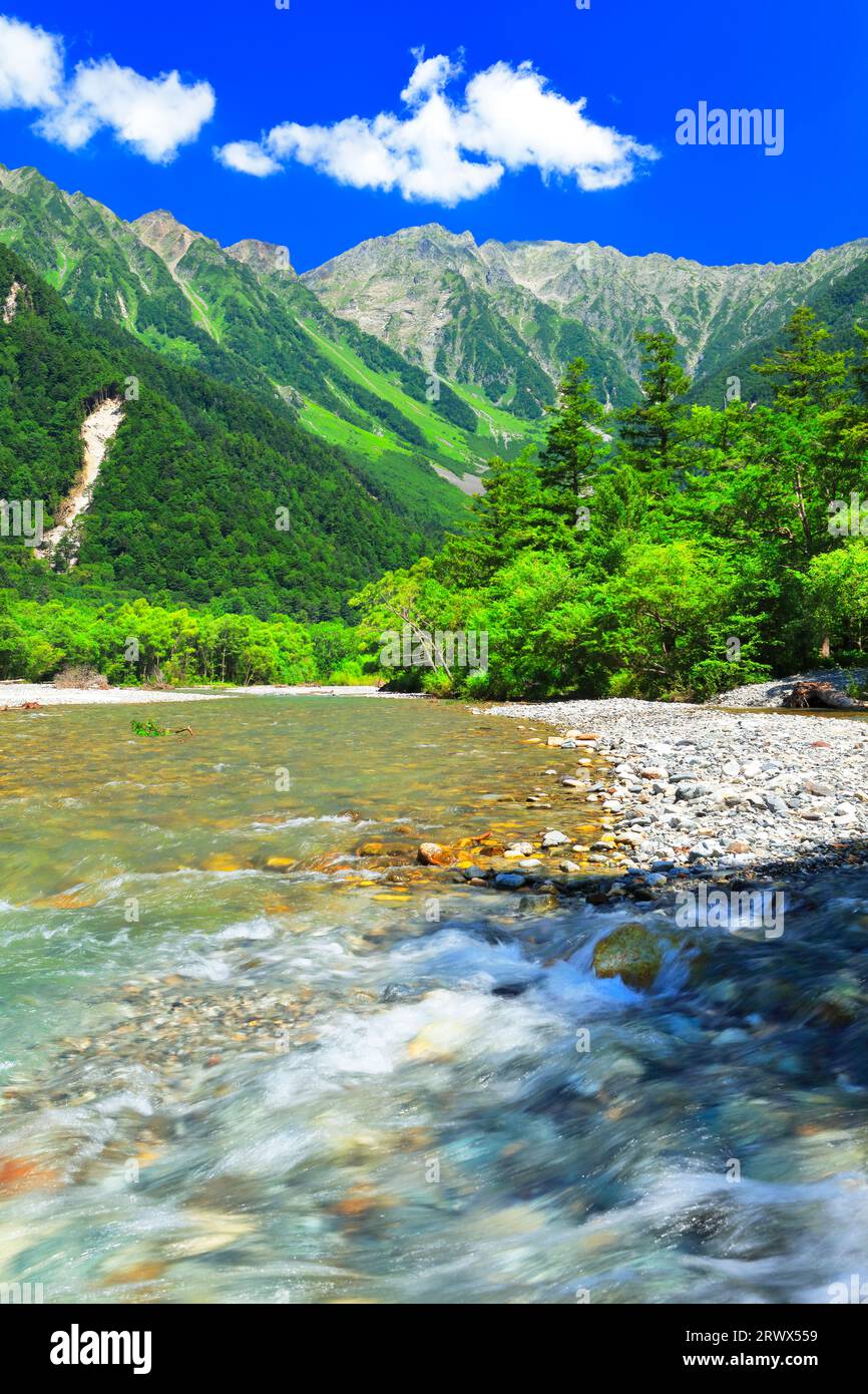 The clear stream of Azusa River and Hotaka mountain range in summer in ...