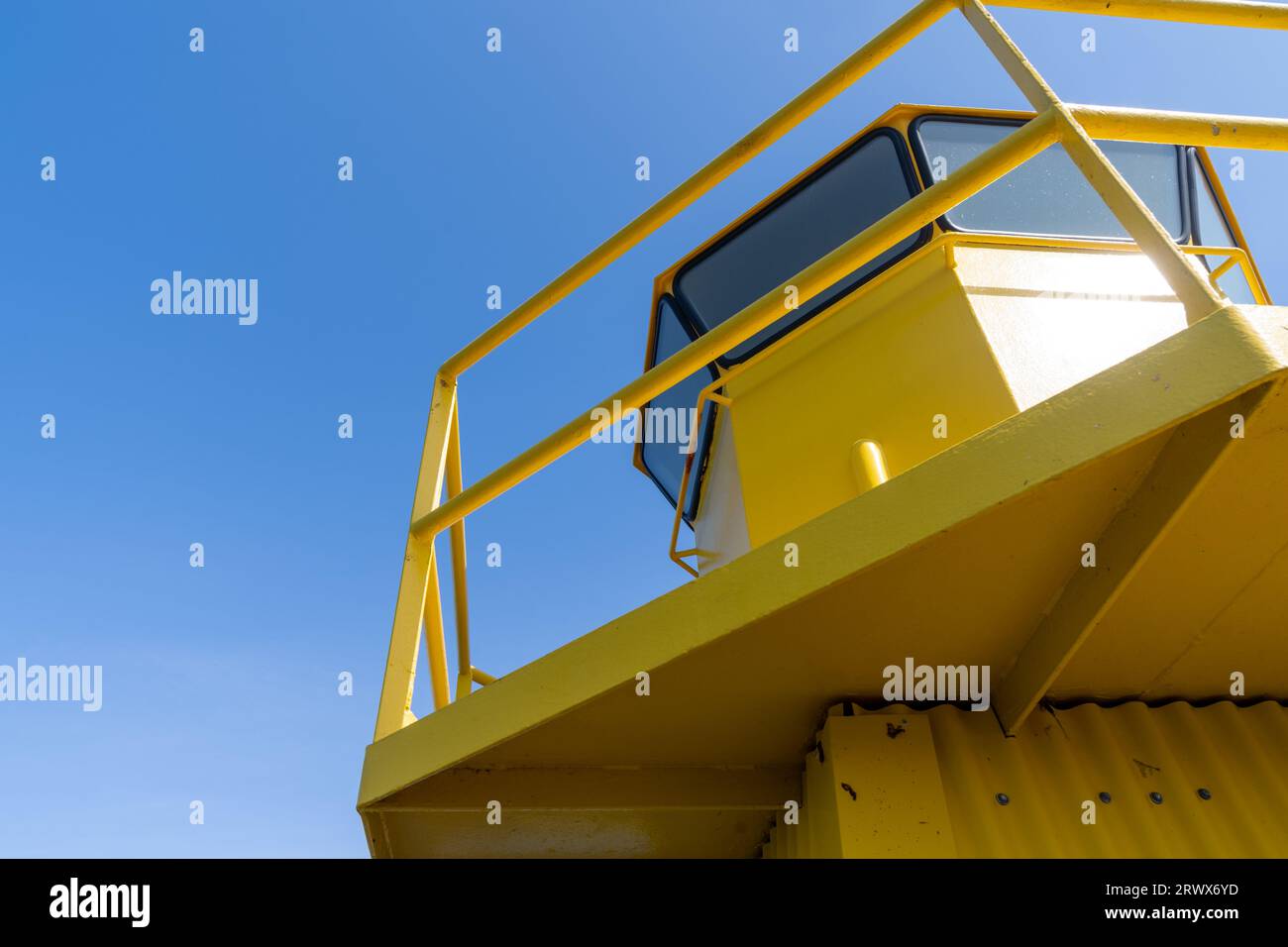 Ingólfsgarður Lighthouse, a cute yellow light house in the harbor of ...