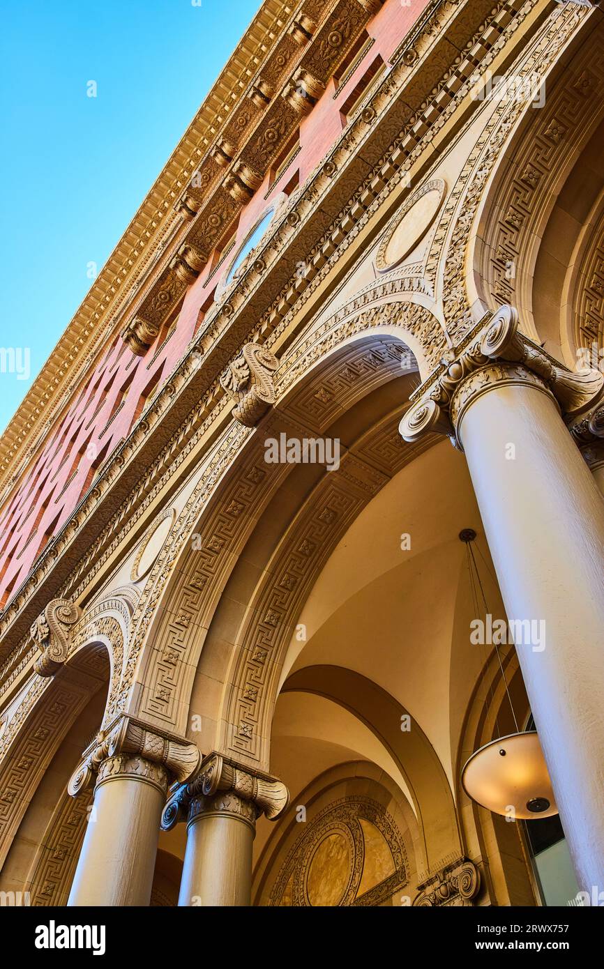 Elaborate carvings on underside and side of building with tall pillars ...