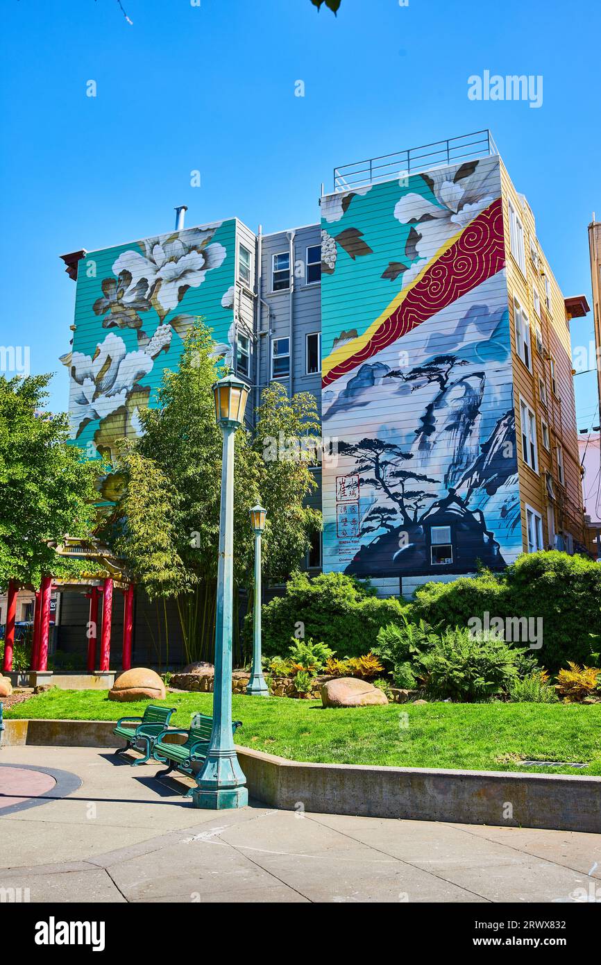 Peaceful and zen art mural on buildings overlooking sunny park with ...