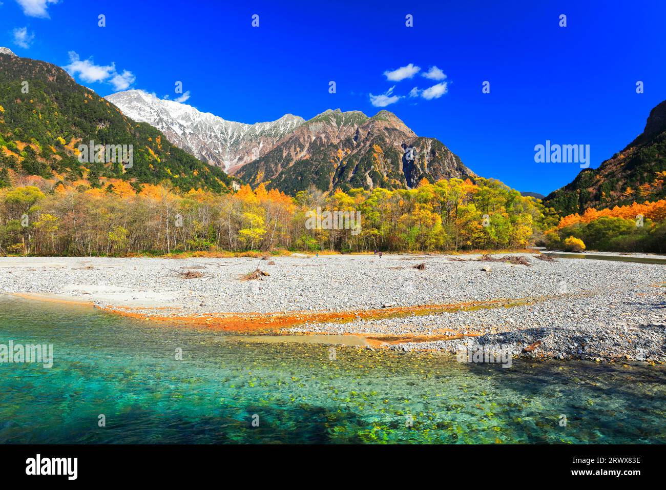Autumn in Kamikochi: Autumn leaves and snow on the Hotaka mountain ...