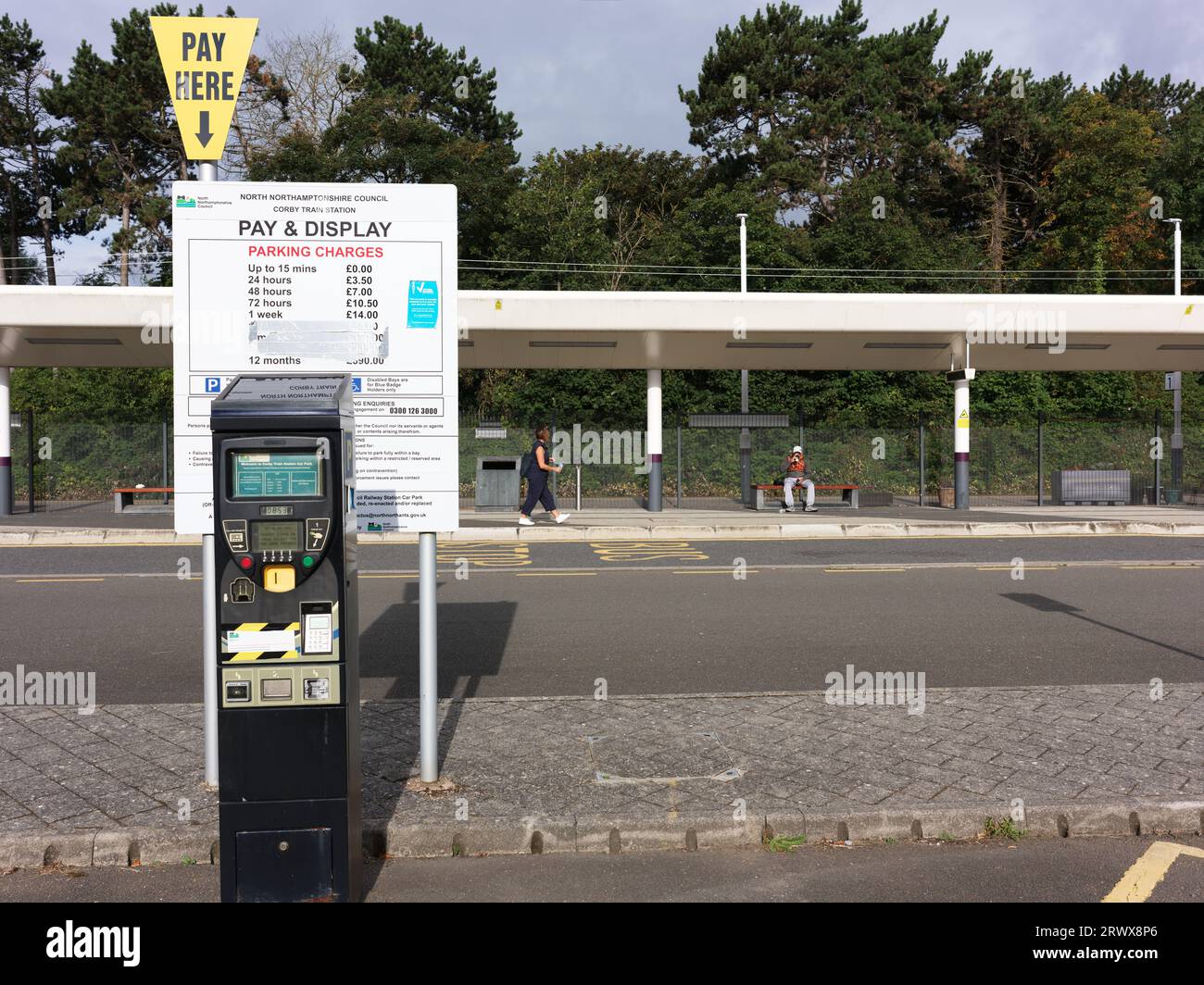 Pay and Display notice and machine in the car park at the rail station ...