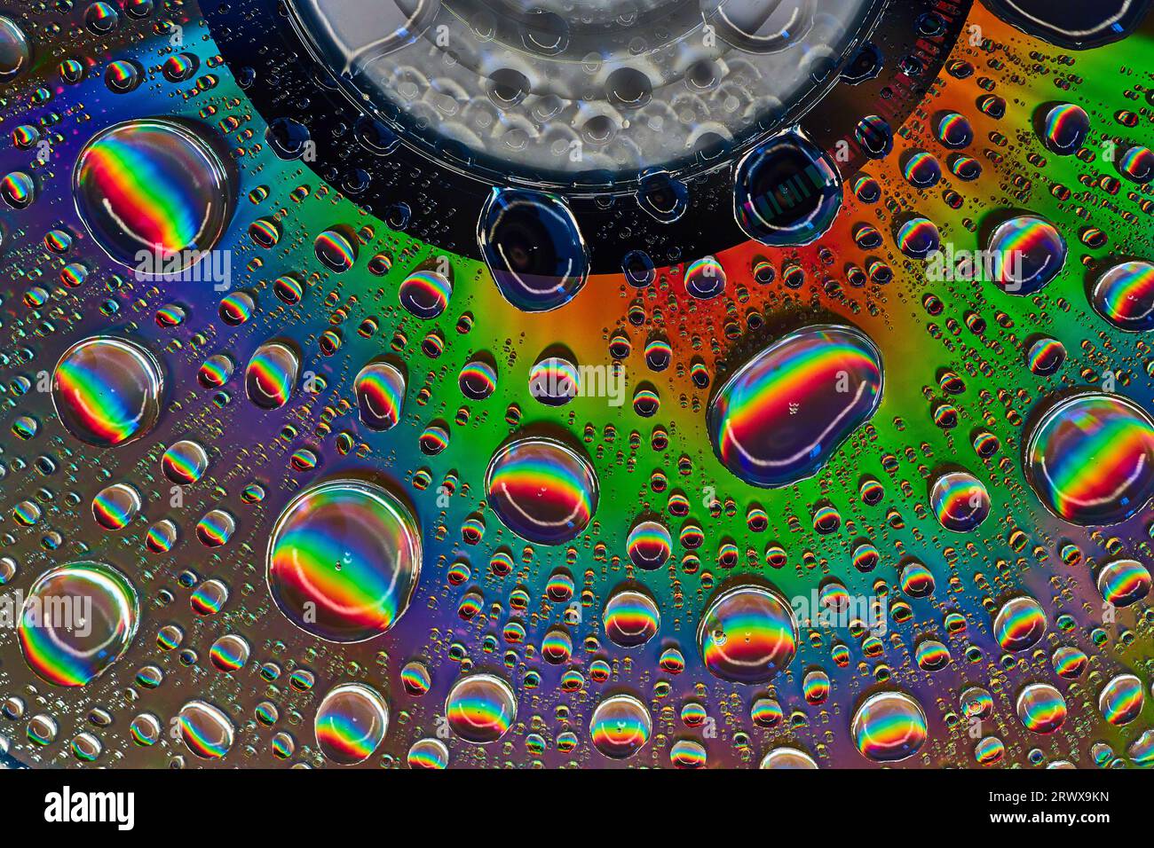 Rainbow burst inside fizzy bubbles floating across colorful metallic ...