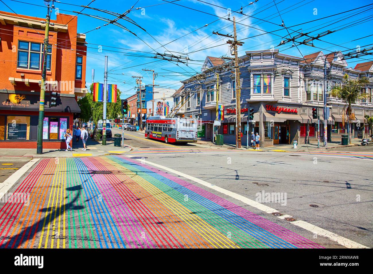 Rainbow crosswalk and view across street with bay windows with rainbow ...