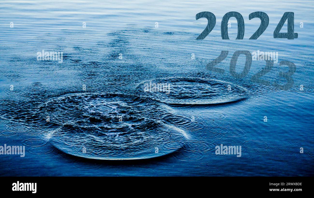Transition from 2023 to new year concept with 2024 text on sea. Happy ...