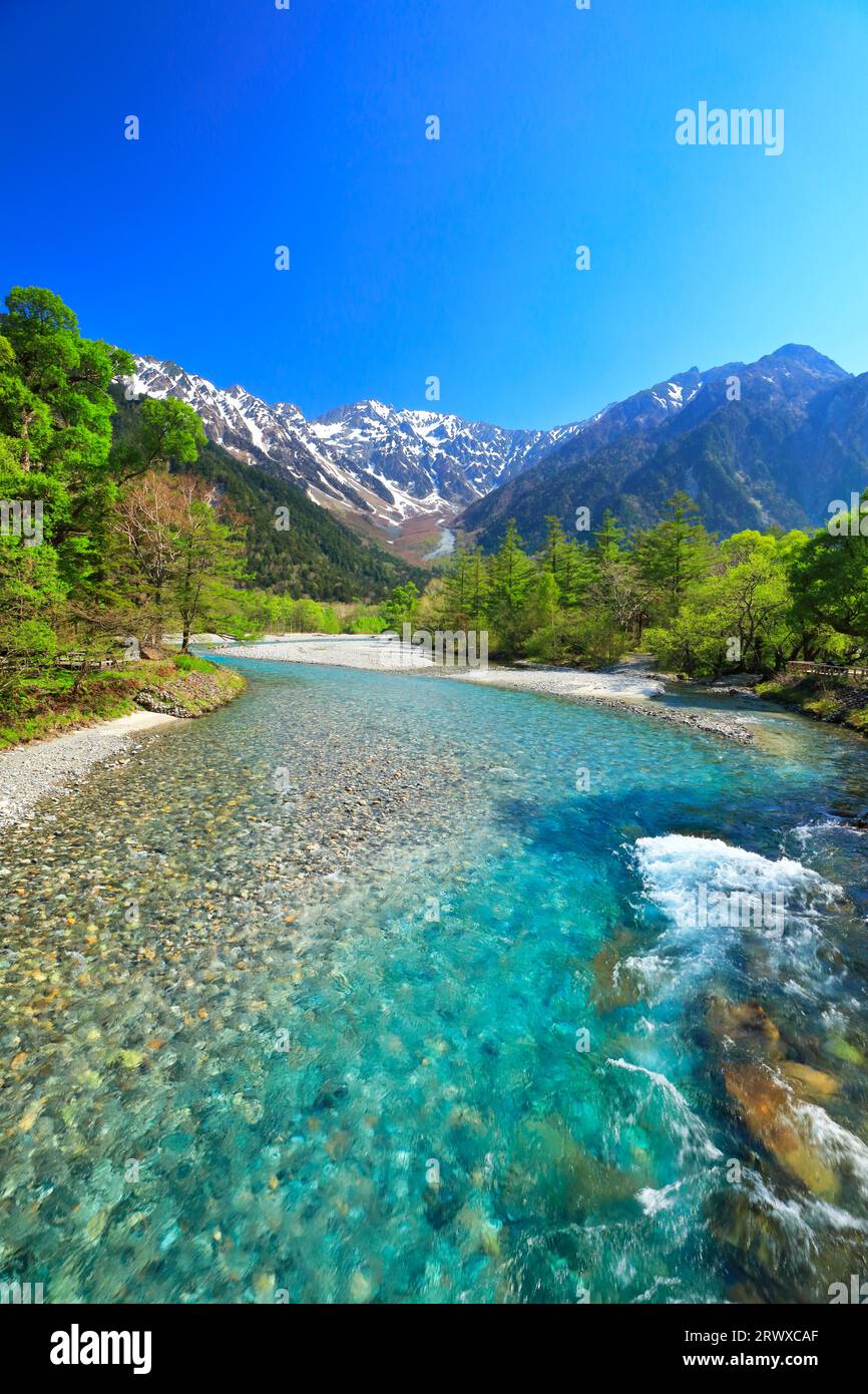 Clear stream of Azusa River and lingering snow on the Hodaka mountain ...