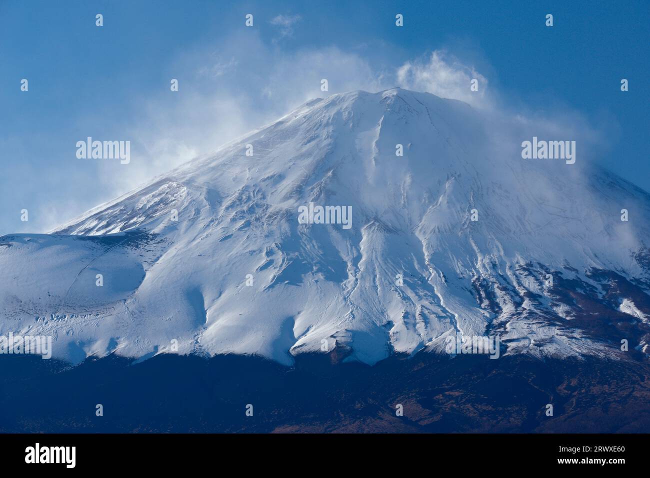 Slopes of Mt. Fuji and snow plume seen from Gotemba City Stock Photo ...