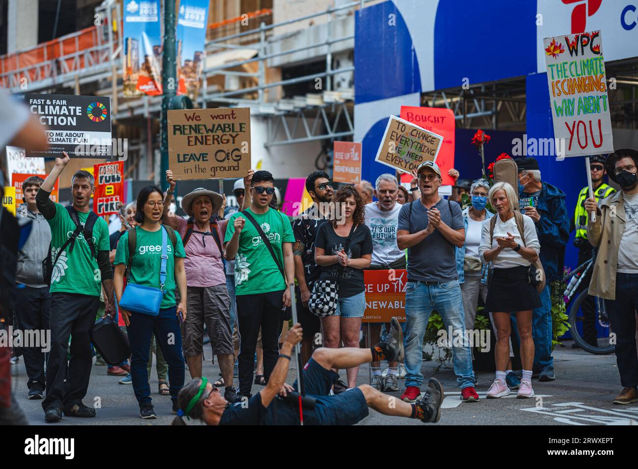 A group of climate change protestors chant and cheer as one of the ...