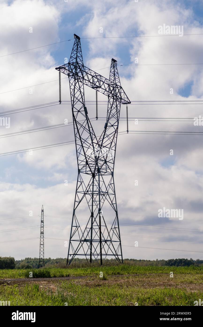 Metal poles electric supports for high-voltage wires in the fields ...