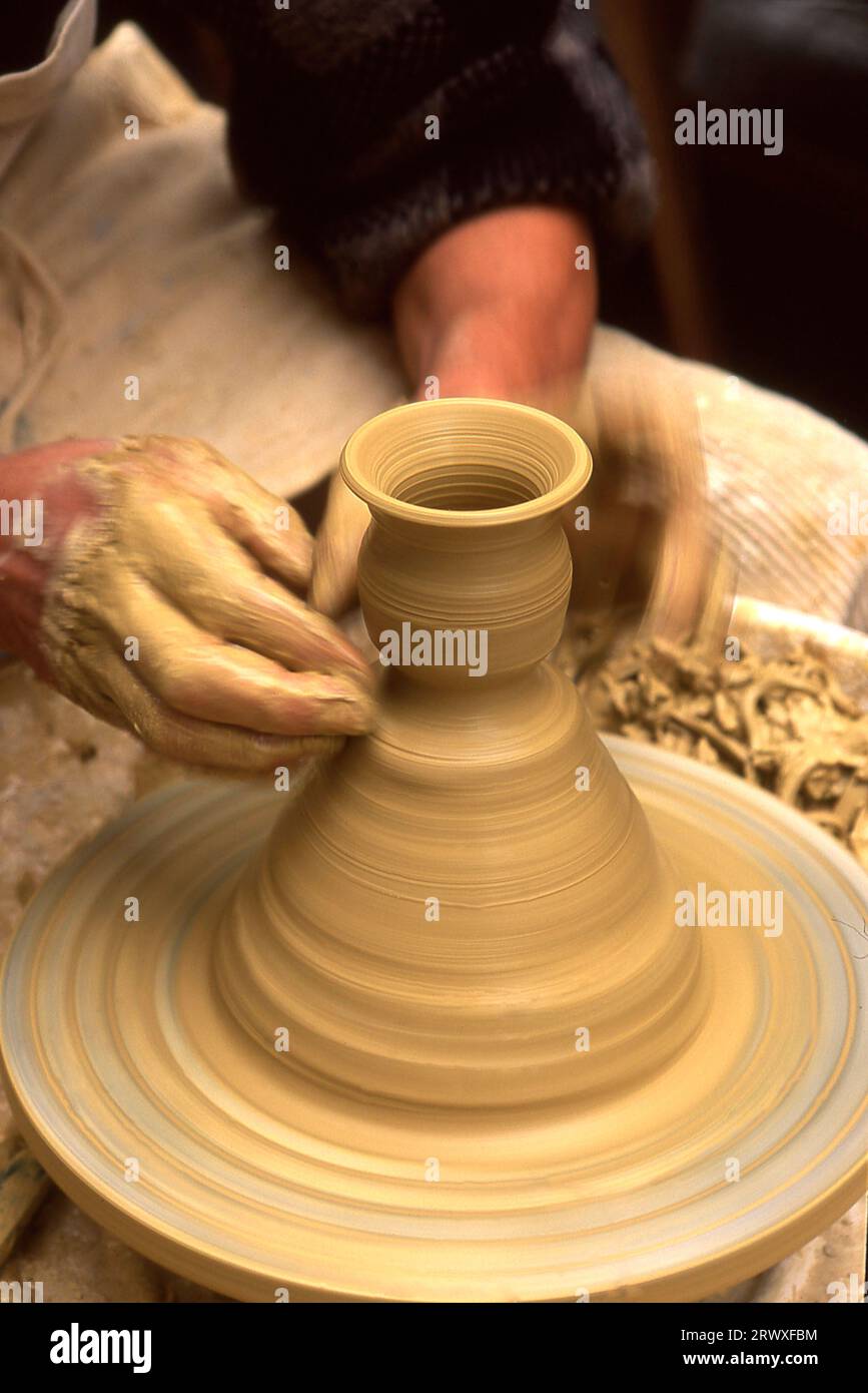 Close-Up of Potter Shaping Clay on a Spinning Wheel Stock Photo - Alamy