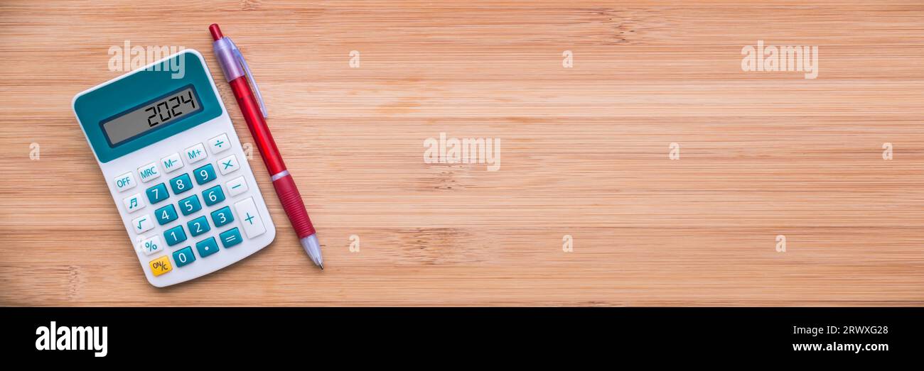 2024 numbers on a calculator on panoramic background with copy space ...