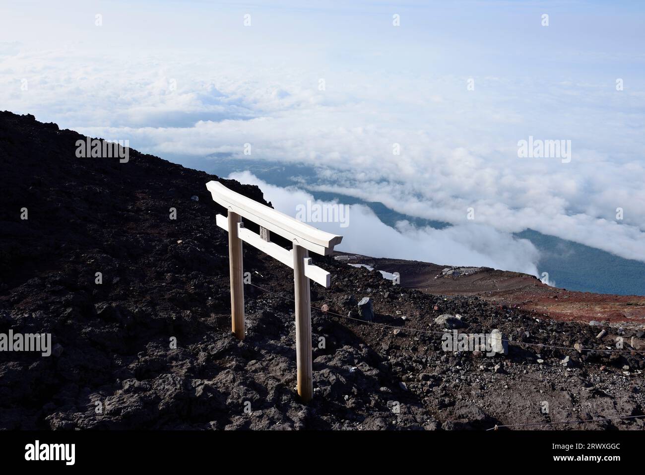 Torii gate and sea of clouds at the summit of Mt. Fuji trail Fujinomiya ...