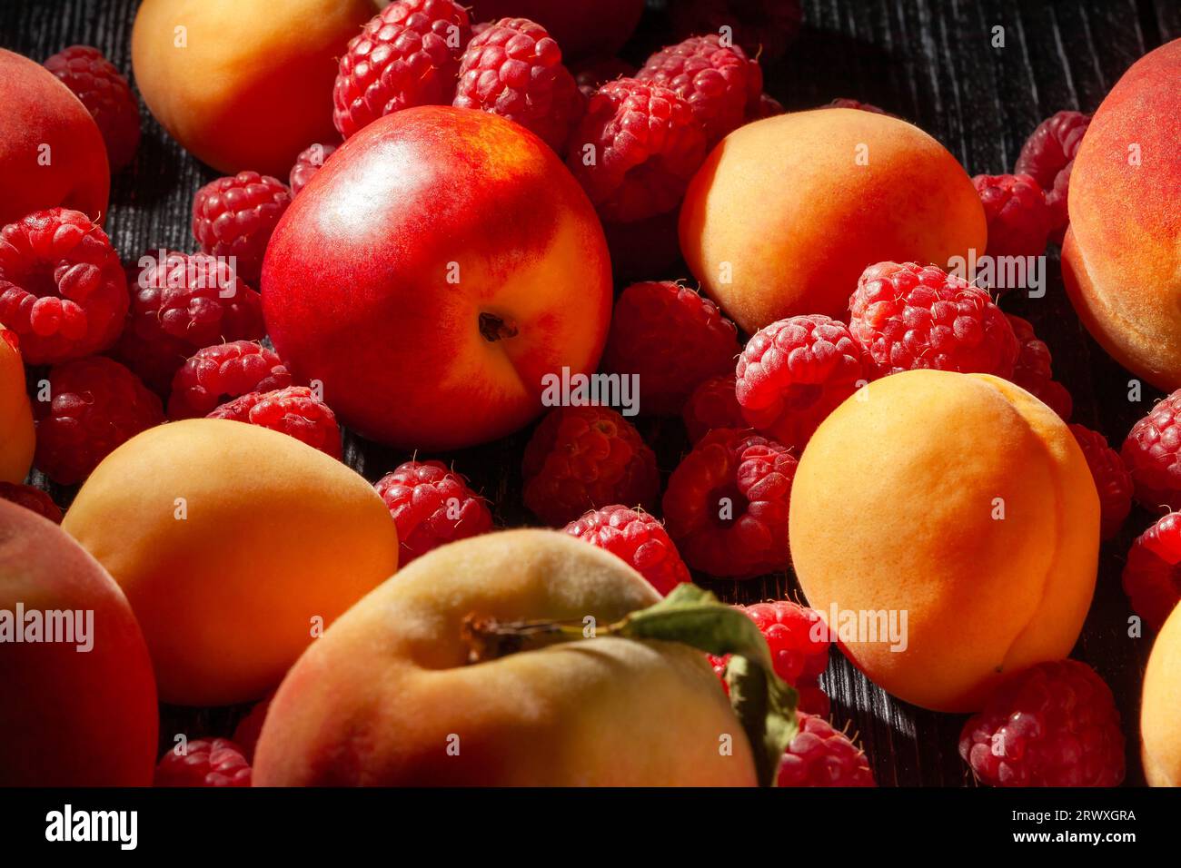 summer fruits mix on wood background Stock Photo - Alamy