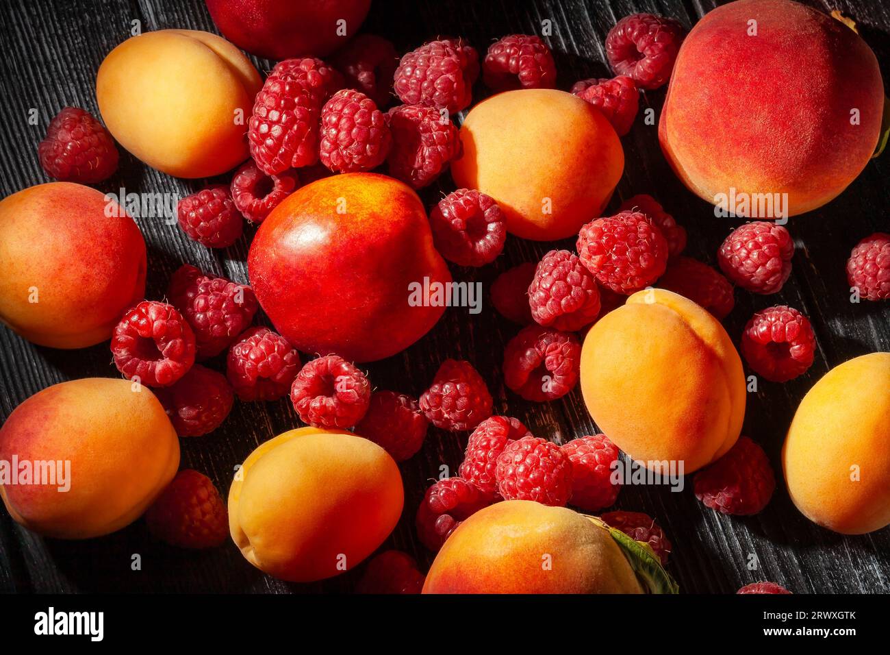summer fruits mix on wood background Stock Photo - Alamy