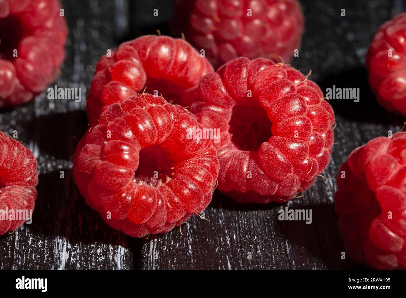 raspberry group on wood background Stock Photo - Alamy