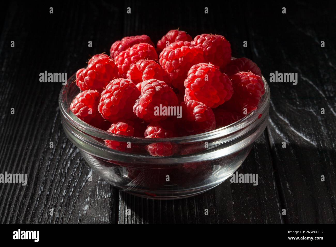 Glass bowl raspberries on hi-res stock photography and images - Alamy