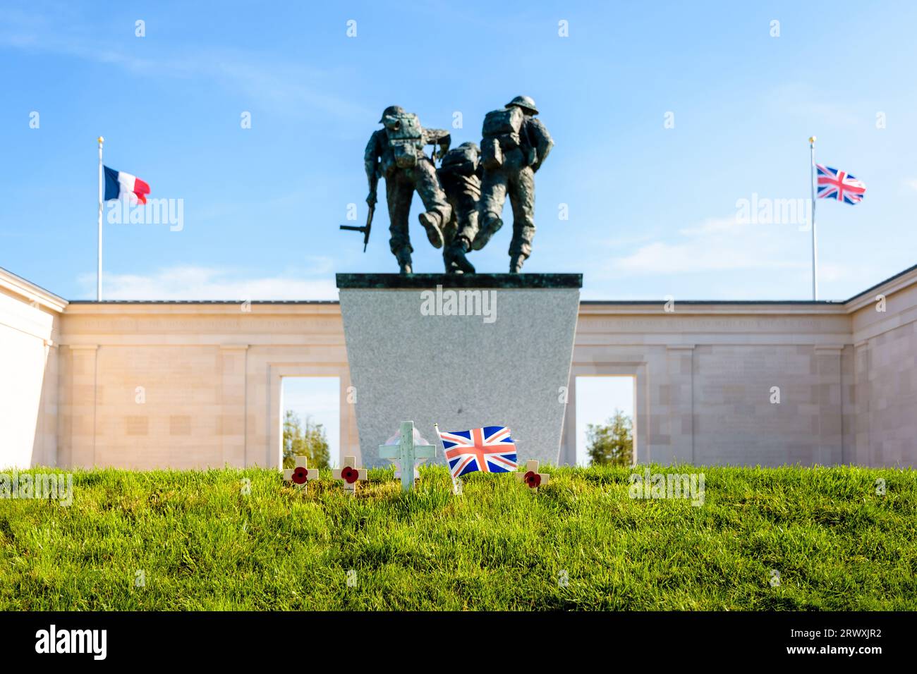 Remembrance poppies behind the "D-Day Sculpture" in the British Normandy Memorial in France ...