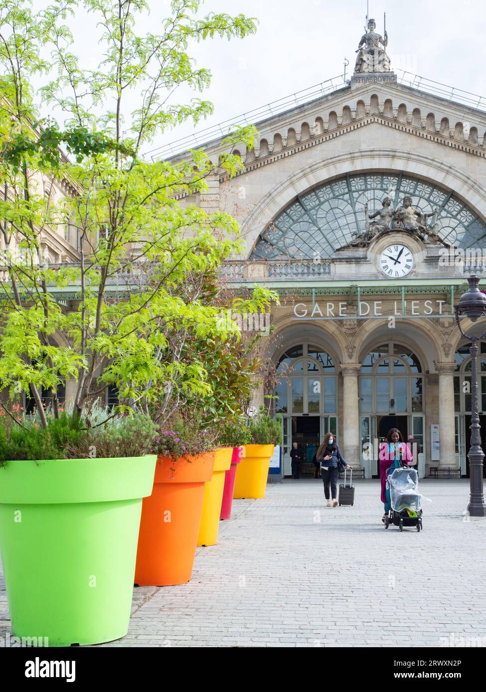 Paris, France - May 12th 2023: A row of plant troughs with small trees ...