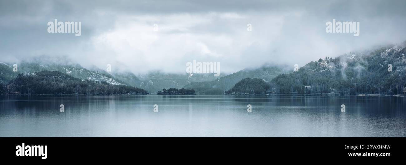 Panorama on blue reflecting lake and clear mountain groved with ...