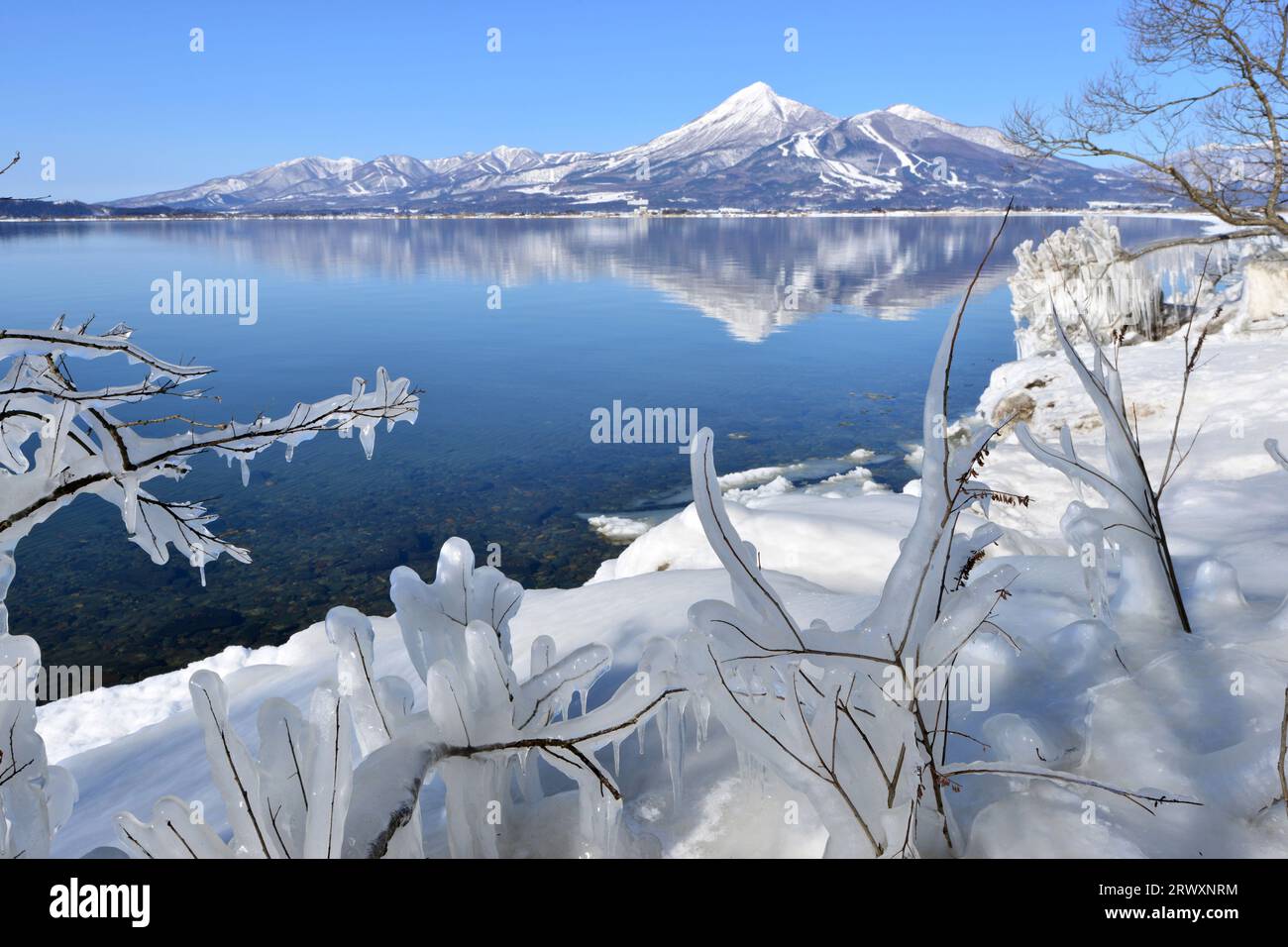 Splashing Ice of Inawashiro Lake and Mt Bandai Stock Photo - Alamy