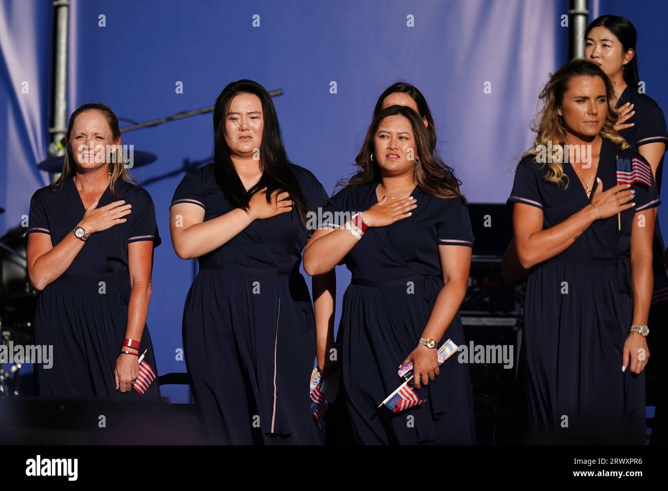 Team USA competitors sing their national anthem during the Opening ...