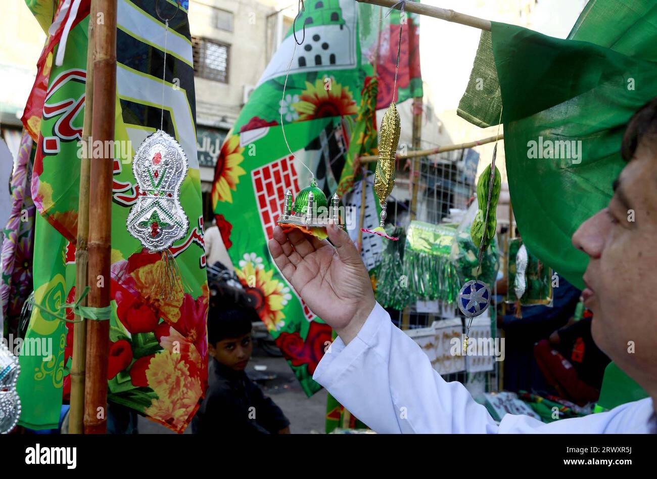 Buntings, flags, badges and souvenirs are being selling at roadside ...