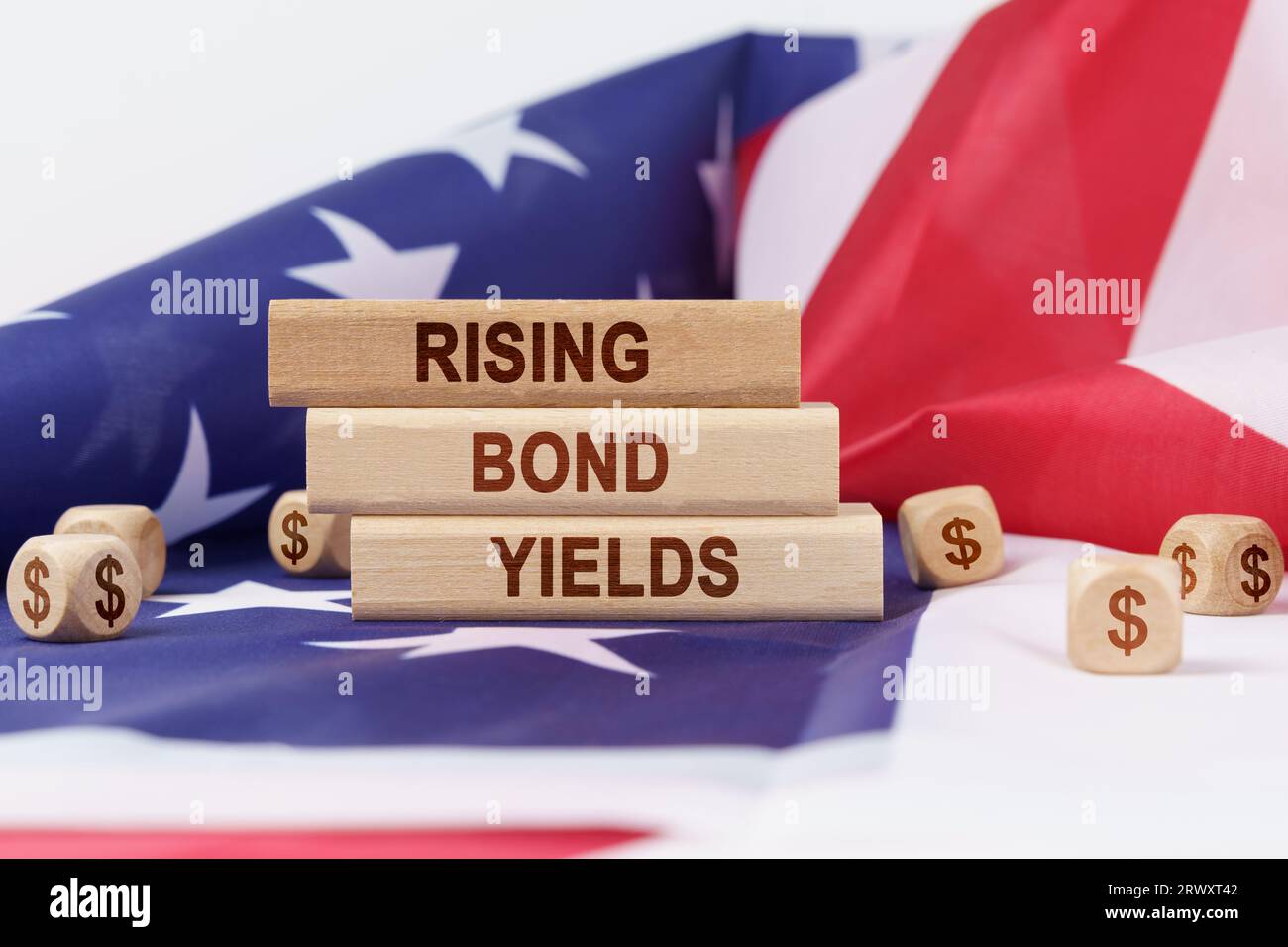 Economy and finance concept. On the flag of the United States lie cubes ...