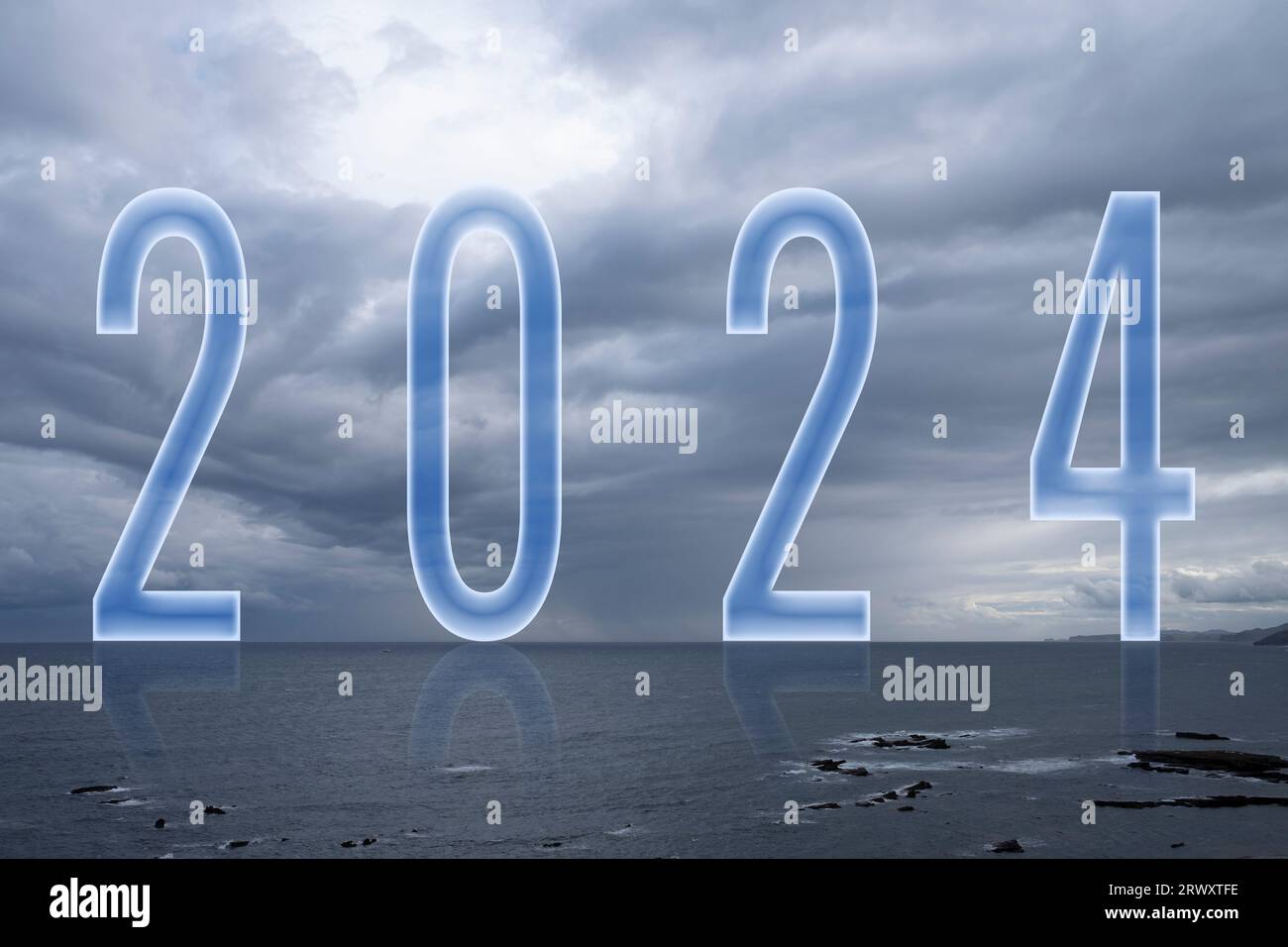 Number 2024 in blue tones on the horizon of the sea with cloudy sky ...