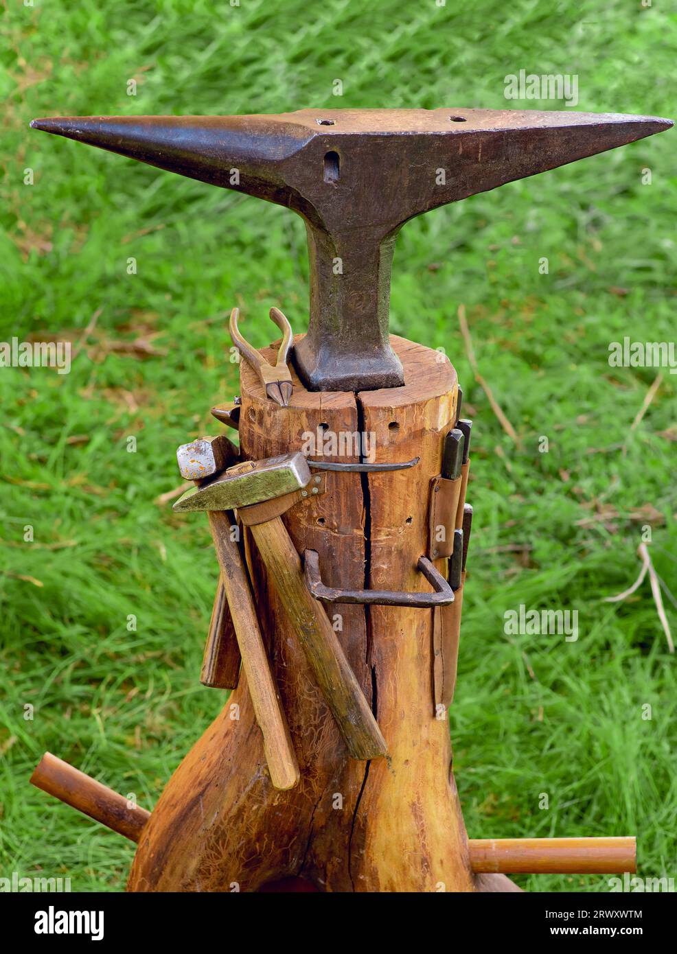 The metal anvil and other tools for blacksmithing on a background of ...