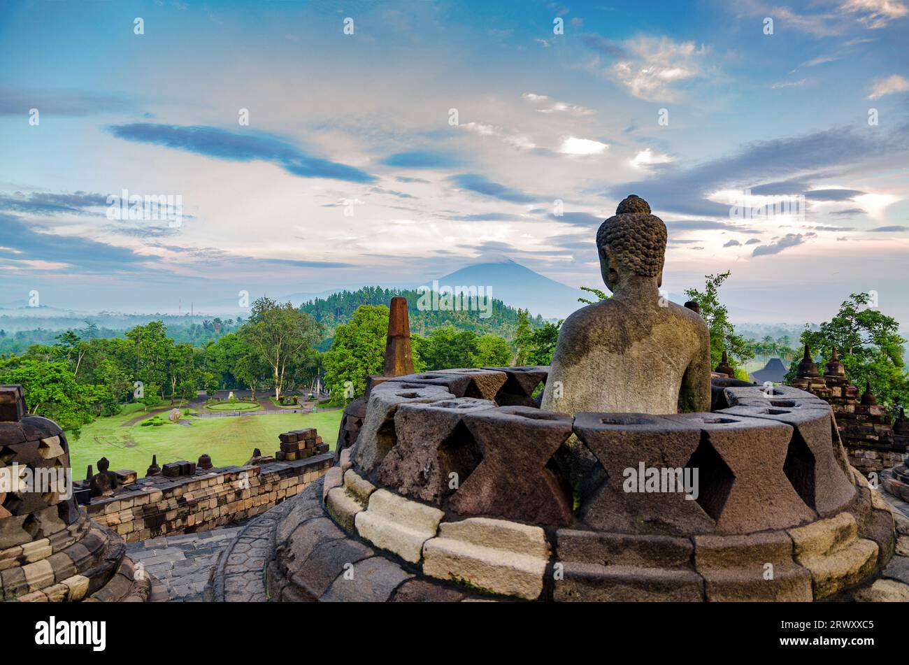 A stone statue of Buddha looks into the distance. Java. Indonesia Stock ...
