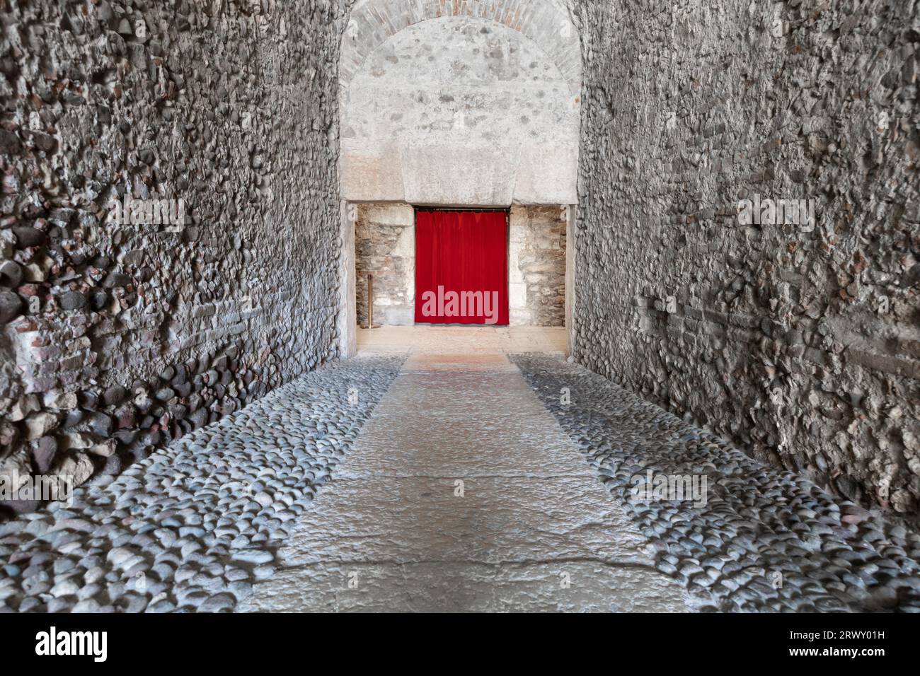 Old corridor with red curtain at the end. Concept for mystery, gothic ...
