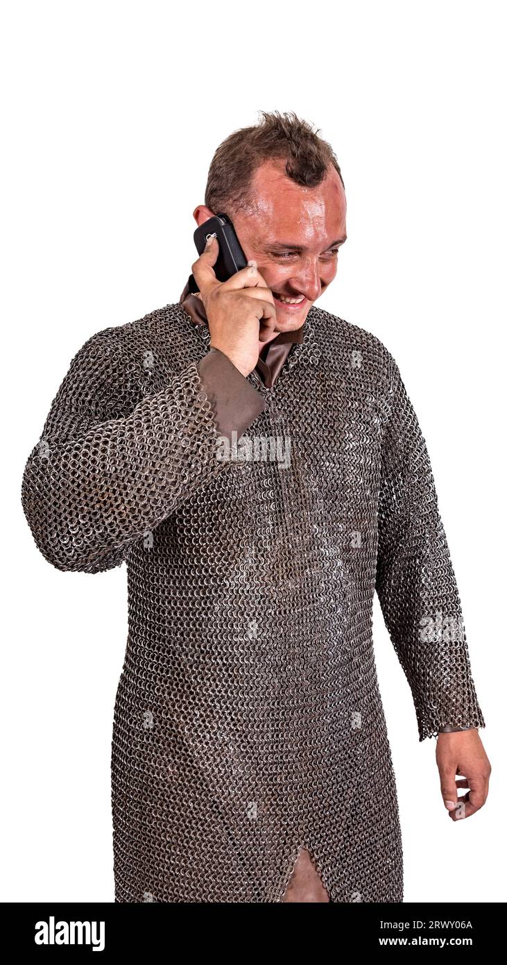 Medieval knight in armor talking on a cell phone. Isolated on white ...