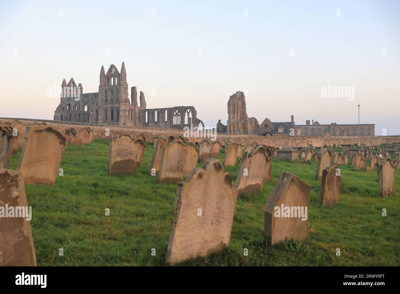 Sunset over the graveyard of historic St Mary's Church on windswept ...