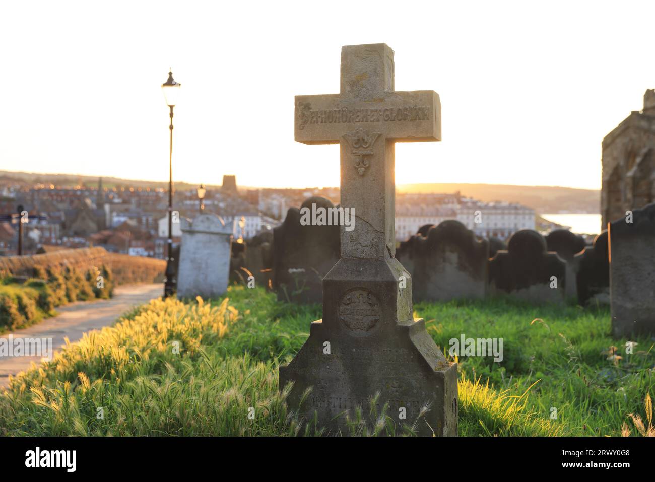 Sunset over the graveyard of historic St Mary's Church on windswept ...
