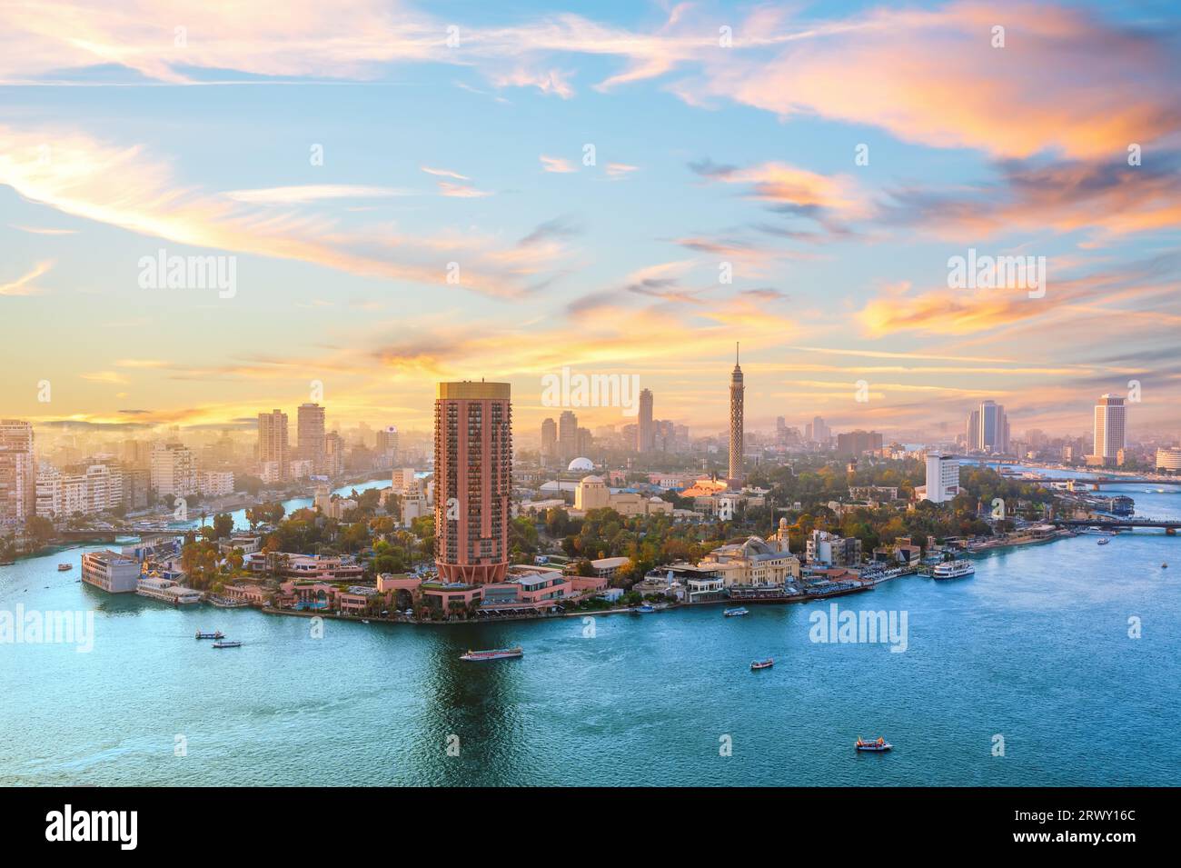 Sunset over the Nile river, fancy buildings and TV tower of Cairo ...