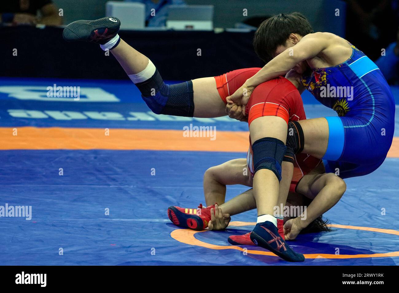 Kyrgyz Aisuluu Tynybekova, right, and Sakura Motoki of Japan compete in ...